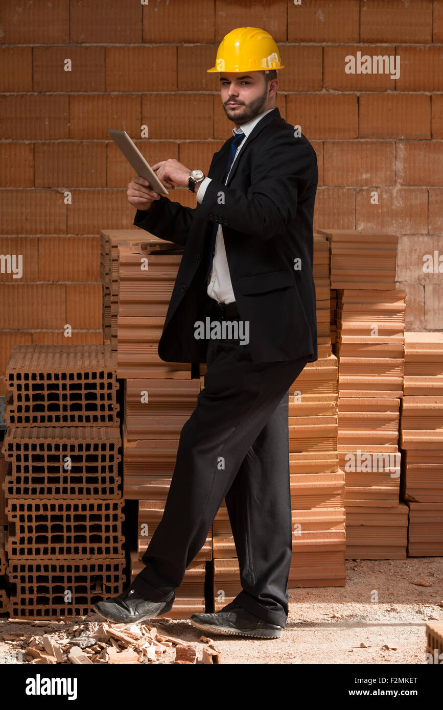 Portrait Of Construction Master With Personal Computer In Hands Stock ...