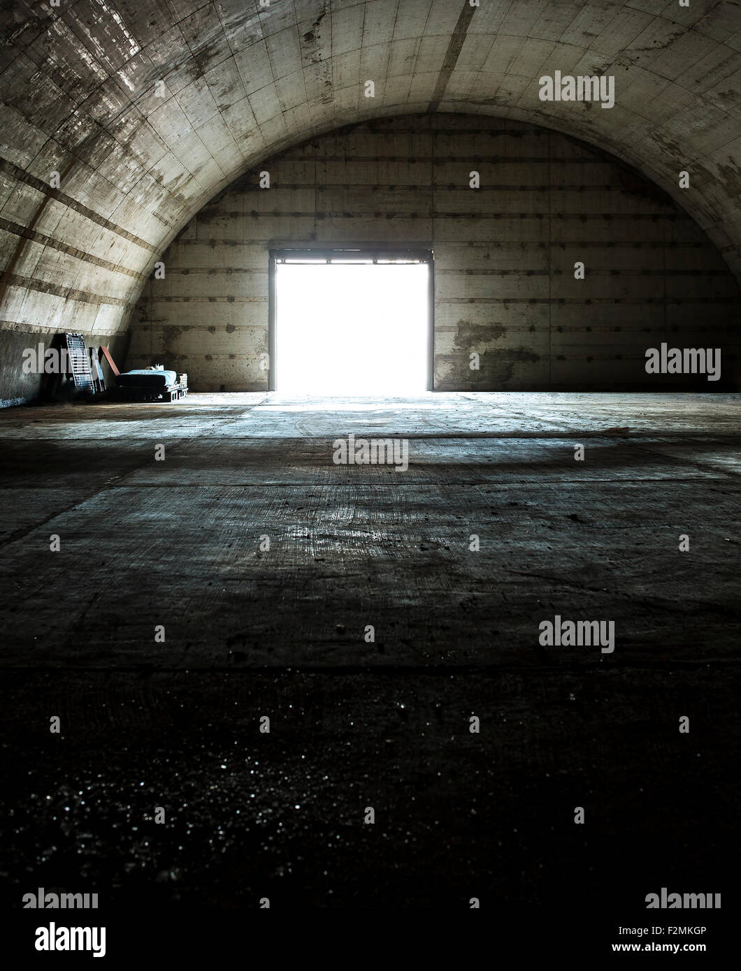 Old military hangar used to storage stuff Stock Photo - Alamy