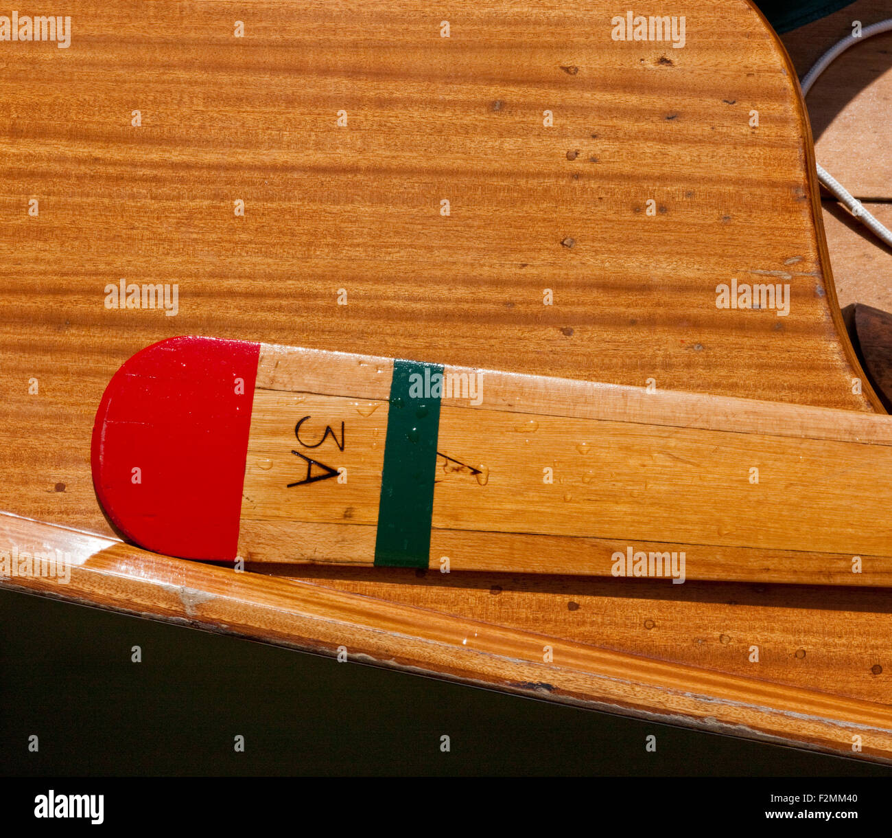 Detail of wood rowboat and oar docked on the Rio San Vio canal ...