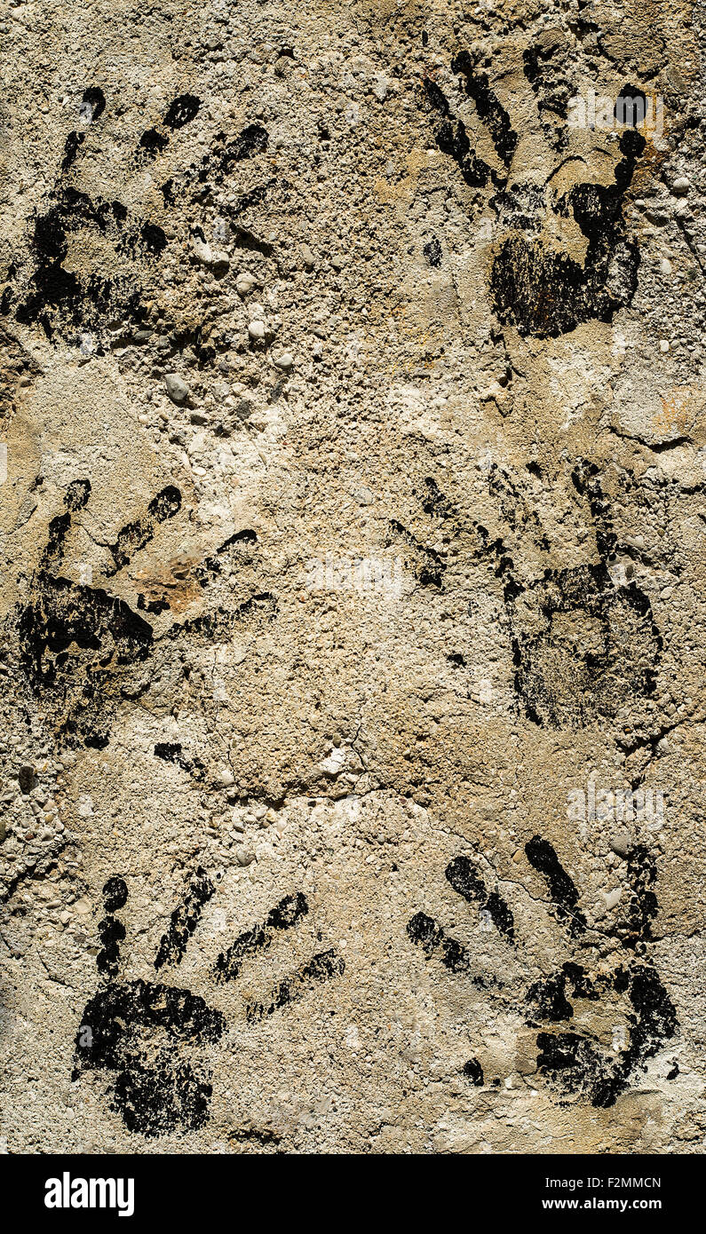 Hands printed on an old wall Stock Photo - Alamy
