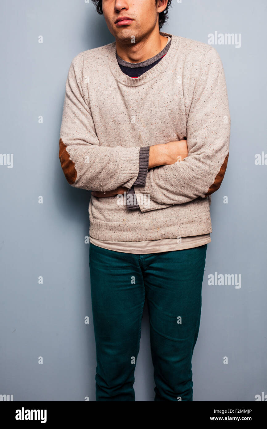 Cold man wearing two jumpers Stock Photo - Alamy