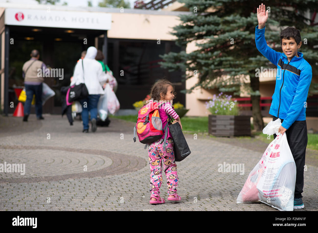 Hahnenklee, Germany. 21st Sep, 2015. A Syrian refugee carrying bags ...
