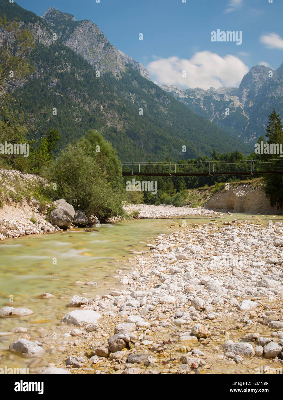 Wooden bridge, over mountain water stream Stock Photo - Alamy