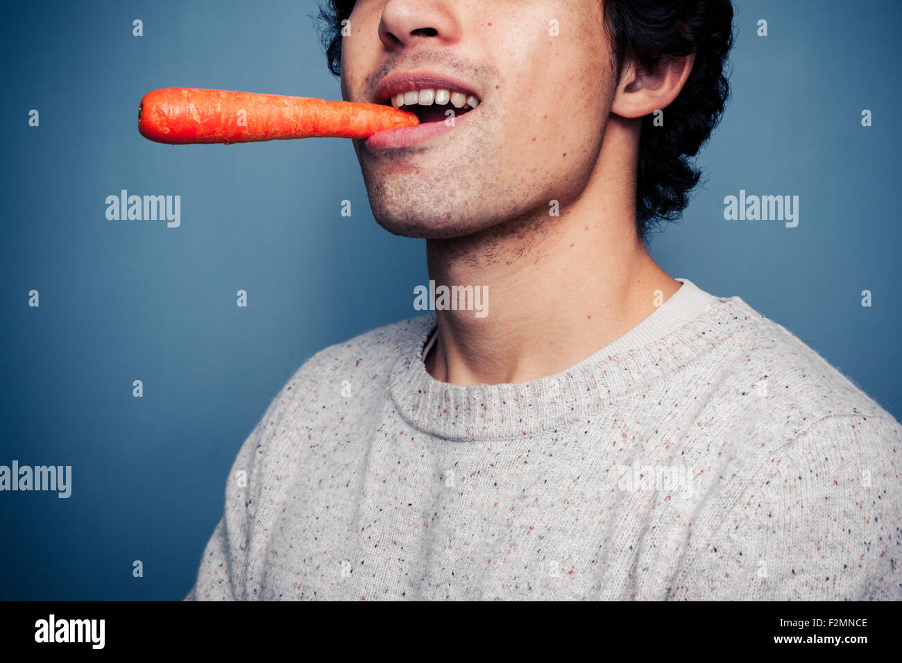 Man eat carrot home hi-res stock photography and images - Alamy