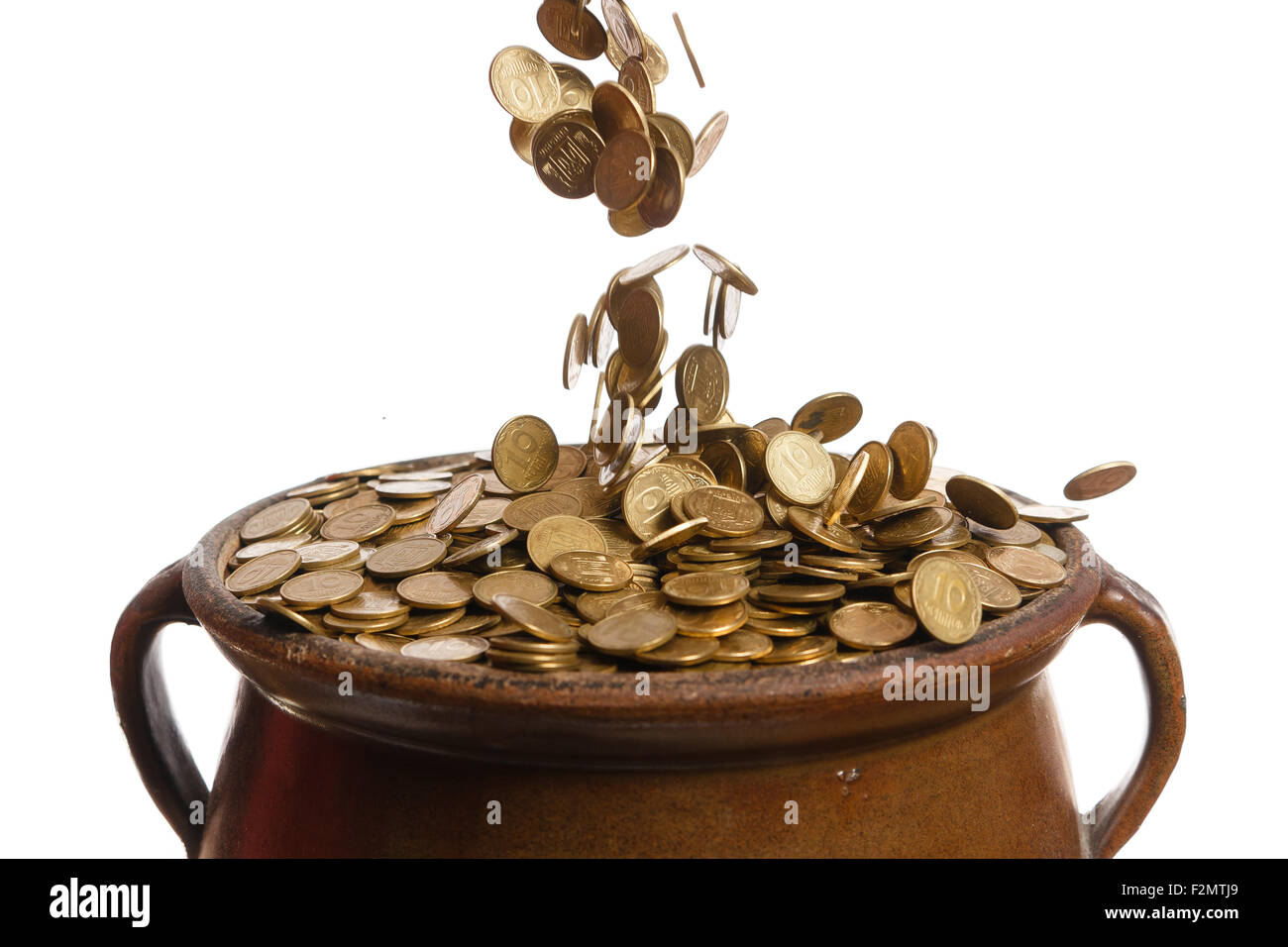 gold coins falling in the vintage pot Stock Photo - Alamy