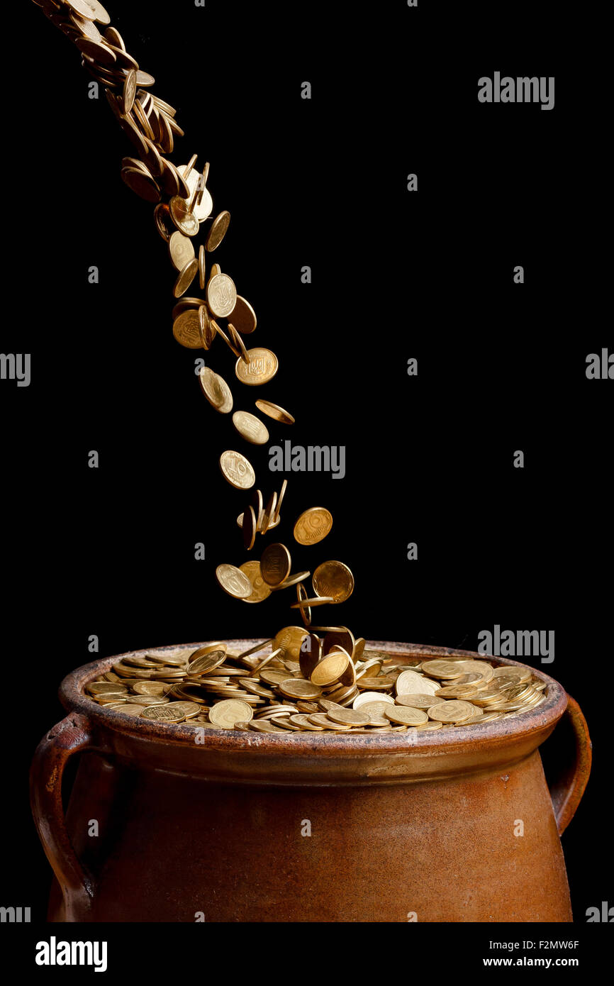 Dollar coins falling pot hi-res stock photography and images - Alamy
