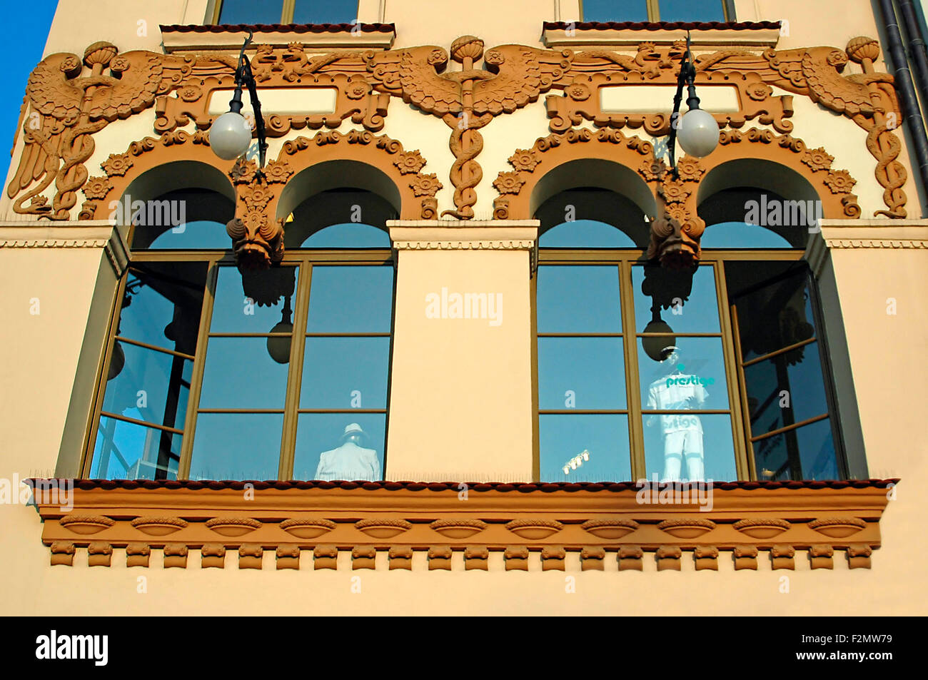 Horizontal detailed view of intricate friezes around windows in Krakow ...