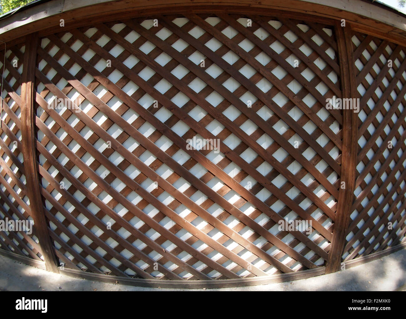 The wall of the building covered with wooden planks crosswise and wide ...