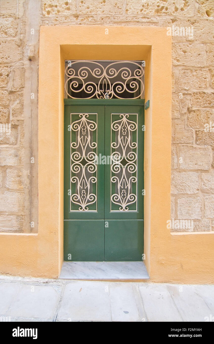 Green wooden door. Painted doors of Malta series Stock Photo - Alamy
