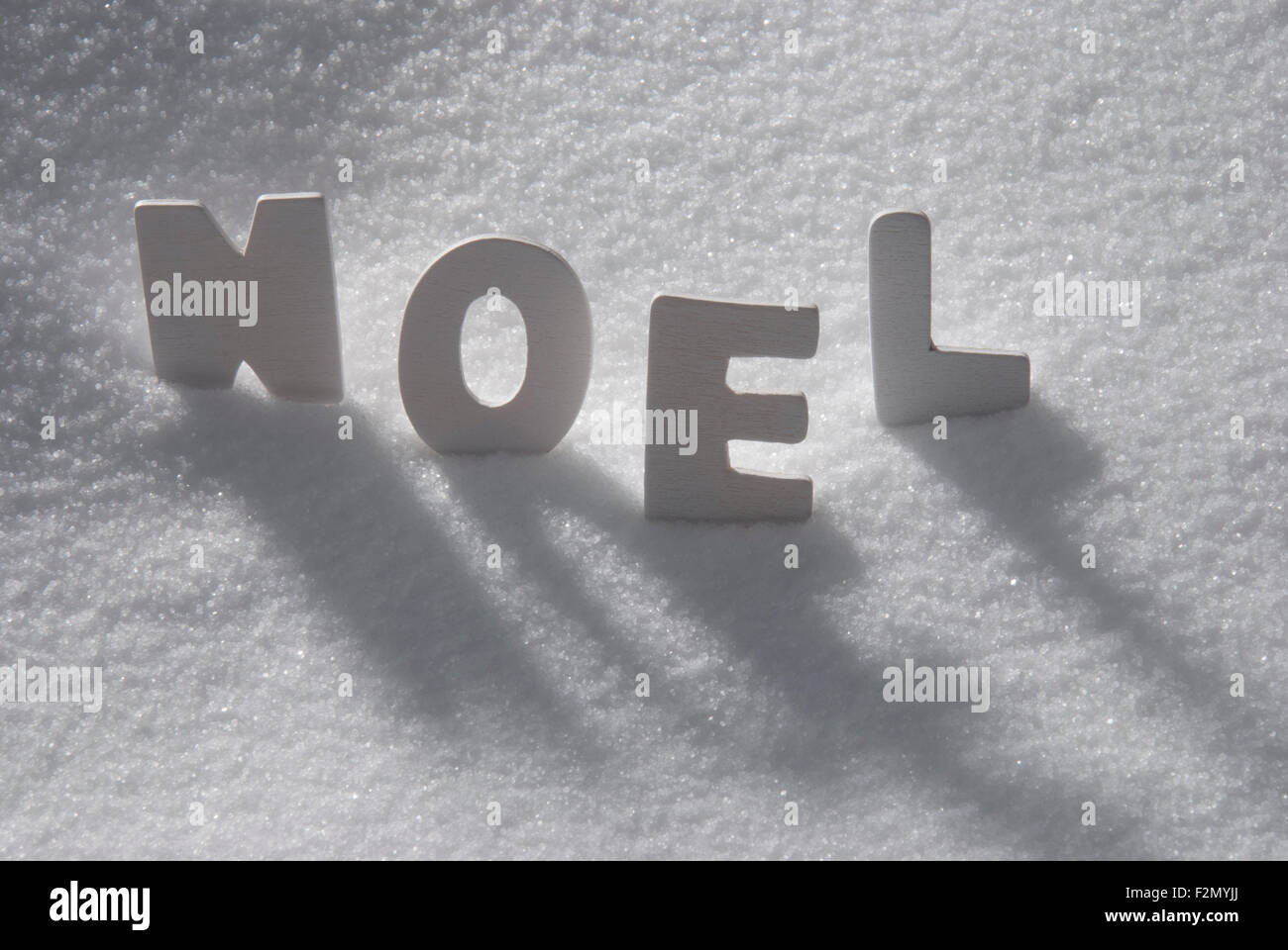 White Word Noel Means Christmas On Snow Stock Photo - Alamy