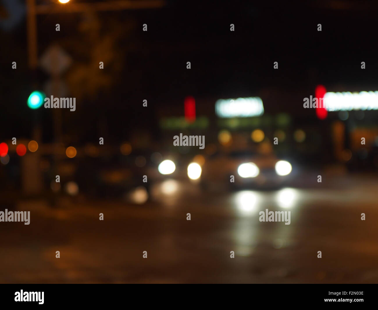 Abstract night scene in the city on the road. Blur and defocused lights ...