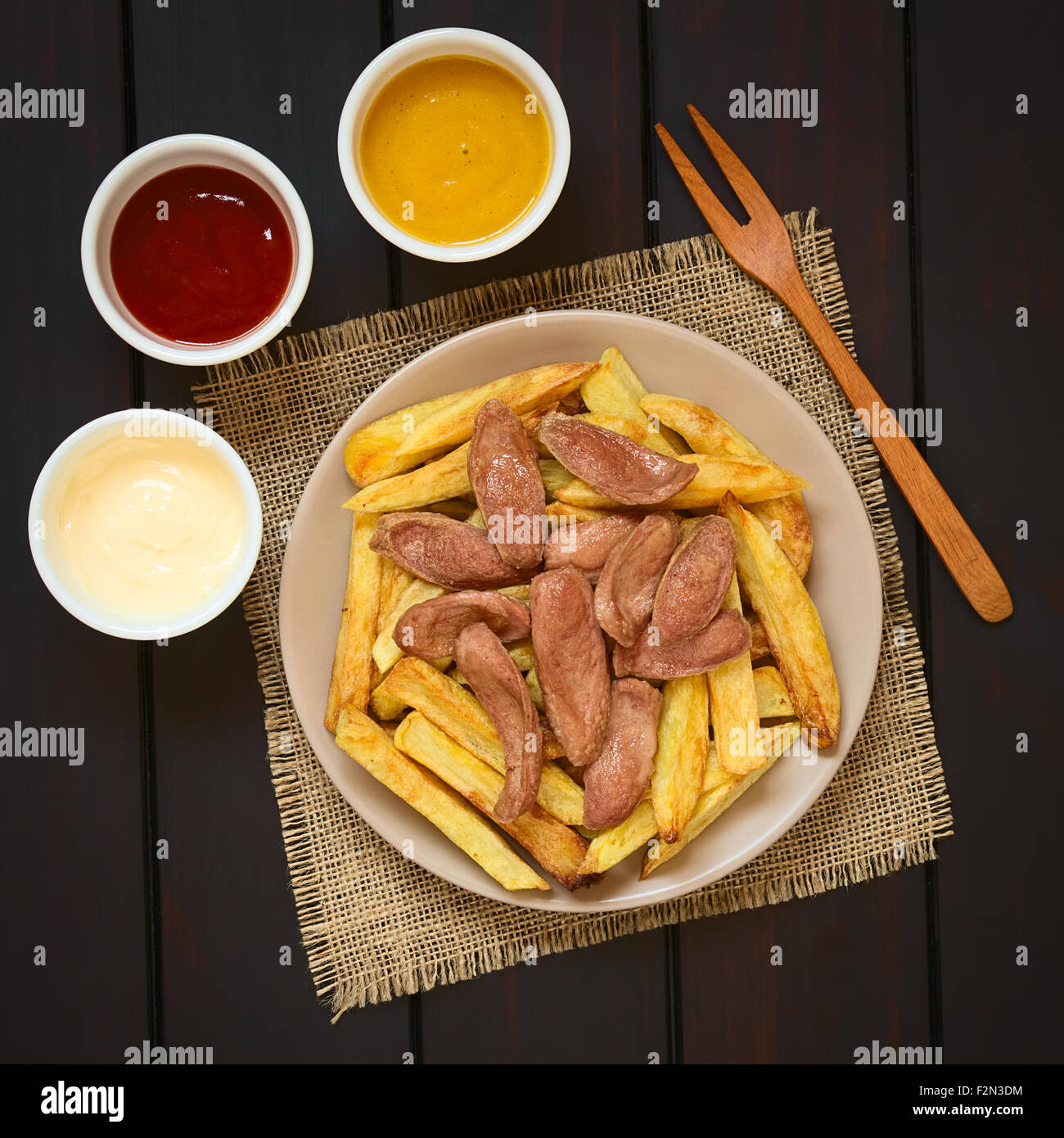 Salchipapas made of French fries and fried sausage, a traditional fast ...