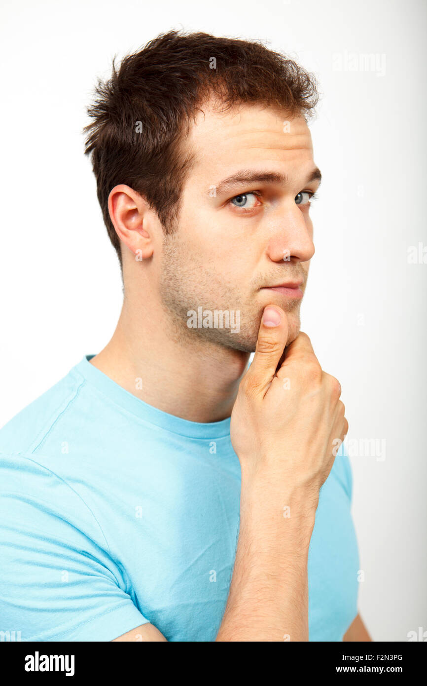 Young man wondering isolated on white Stock Photo - Alamy