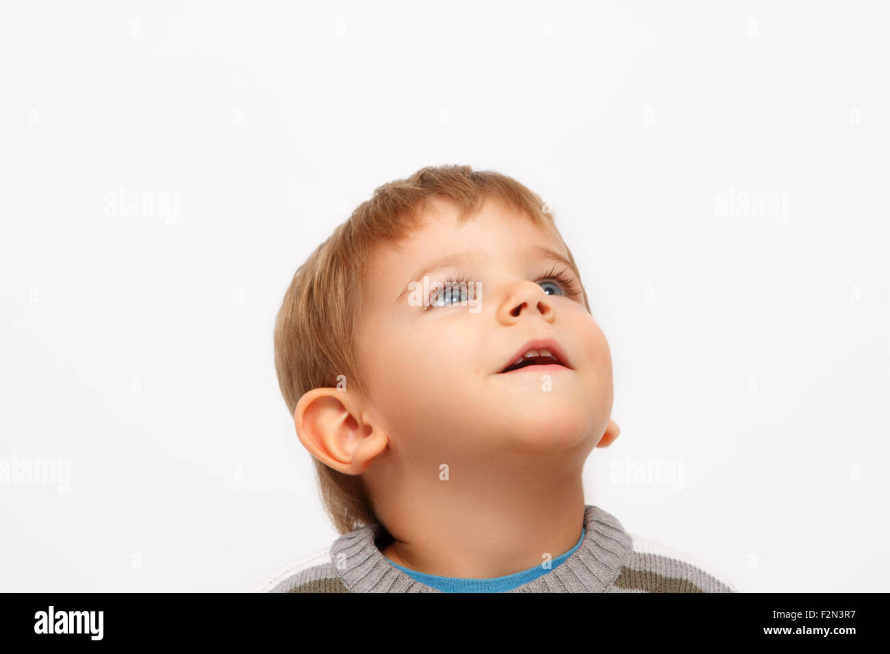 Kid looking up isolated on white Stock Photo - Alamy