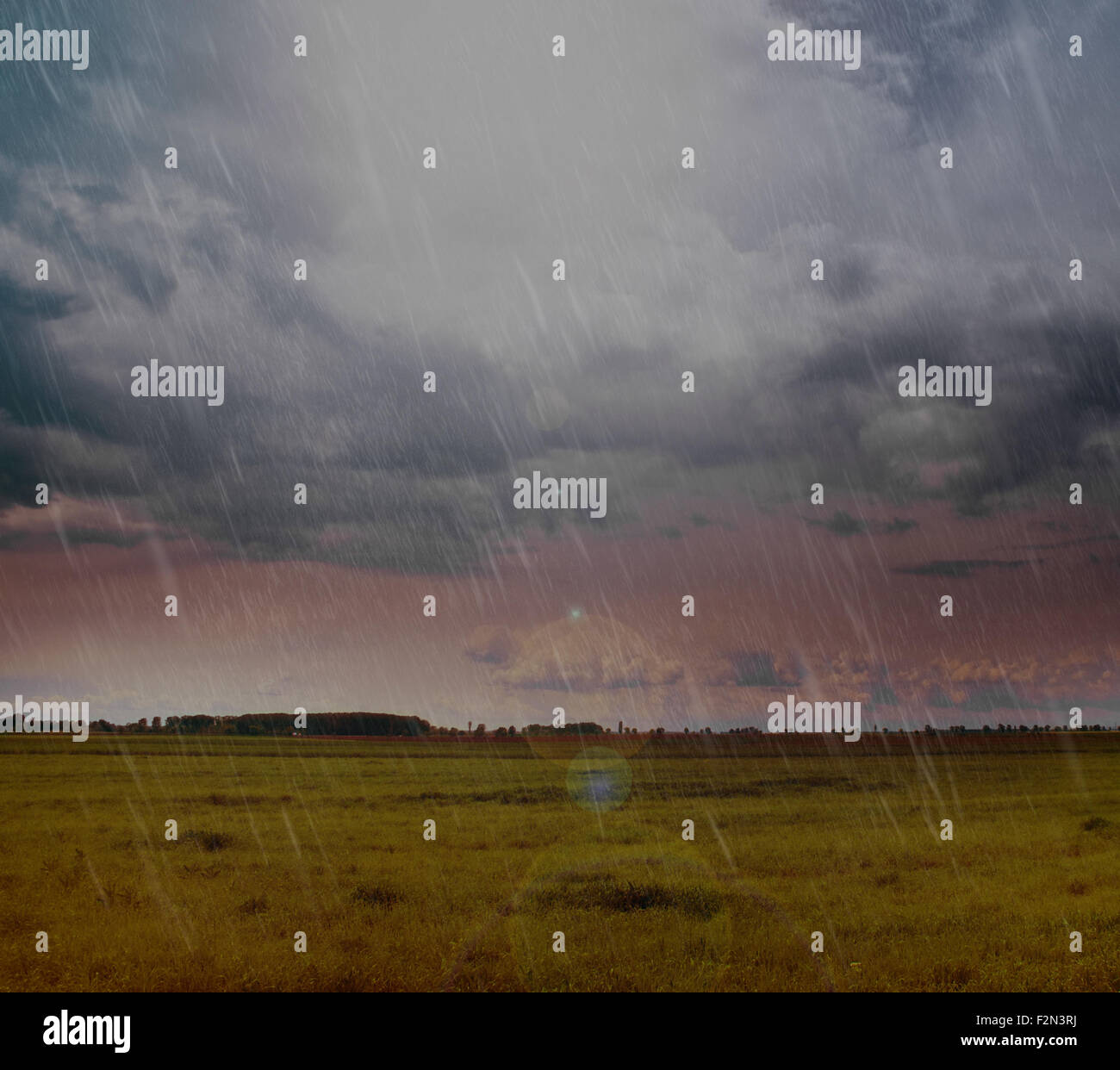 Landscape of rain and clouds over country field Stock Photo - Alamy