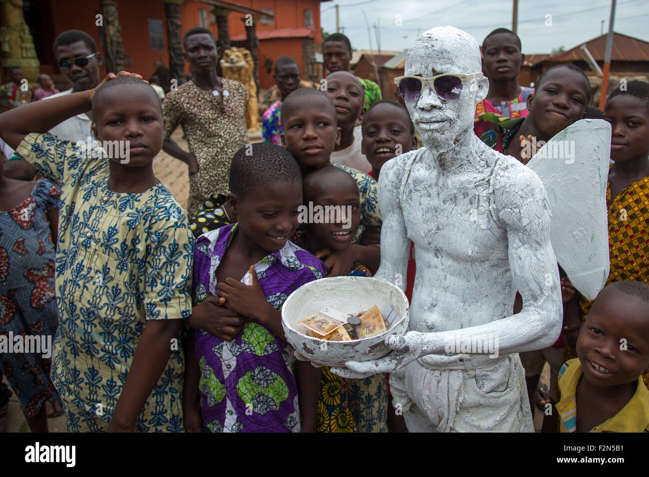 Benin, West Africa, Savalou, man disguised as an angel collecting money ...
