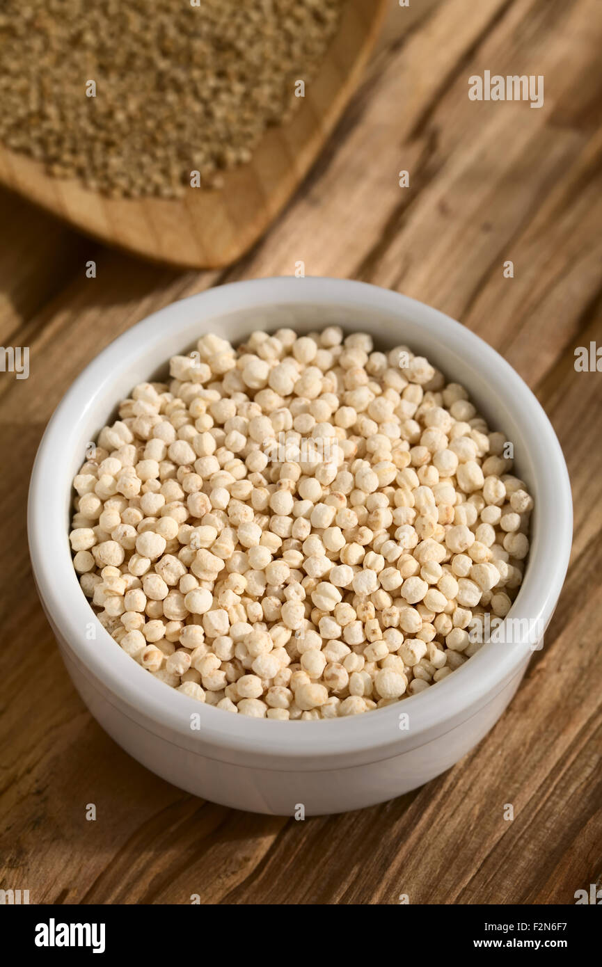 Popped white quinoa (lat. Chenopodium quinoa) cereal in small bowl, raw ...