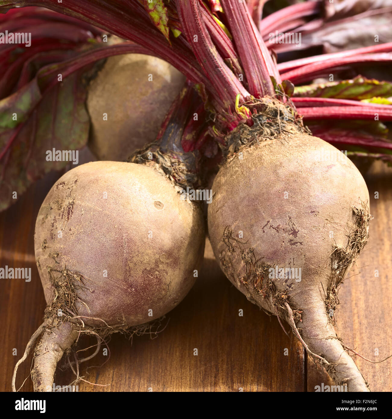 Raw beetroot with leaves photographed on wood with natural light ...