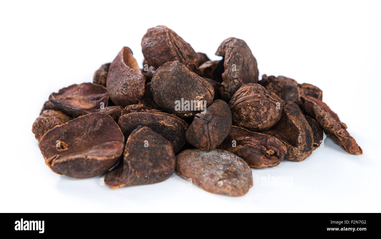 Whole dried Cola Nuts (close-up shot) isolated on white background ...