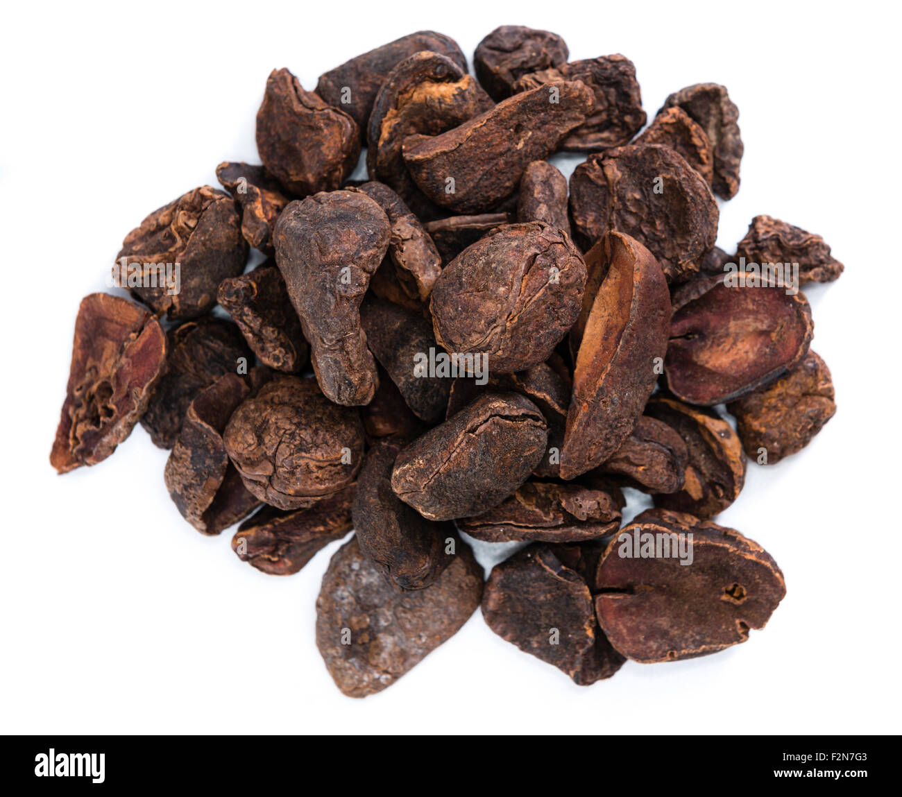 Whole dried Cola Nuts (close-up shot) isolated on white background ...