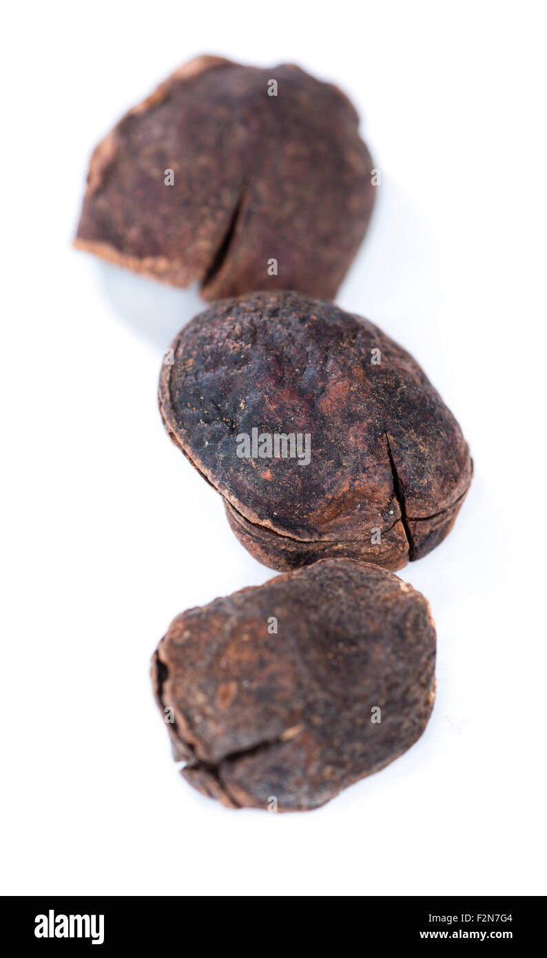 Whole dried Cola Nuts (close-up shot) isolated on white background ...