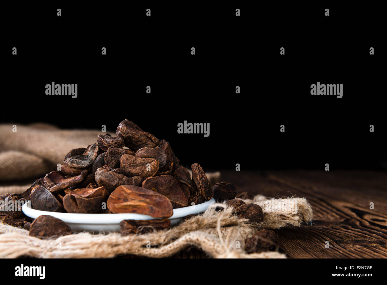 Dried Cola Nuts (whole ones) on vintage wooden background Stock Photo ...