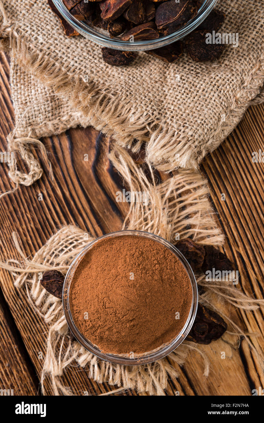 Some Cola Nut Powder (close-up shot) on wooden background Stock Photo ...