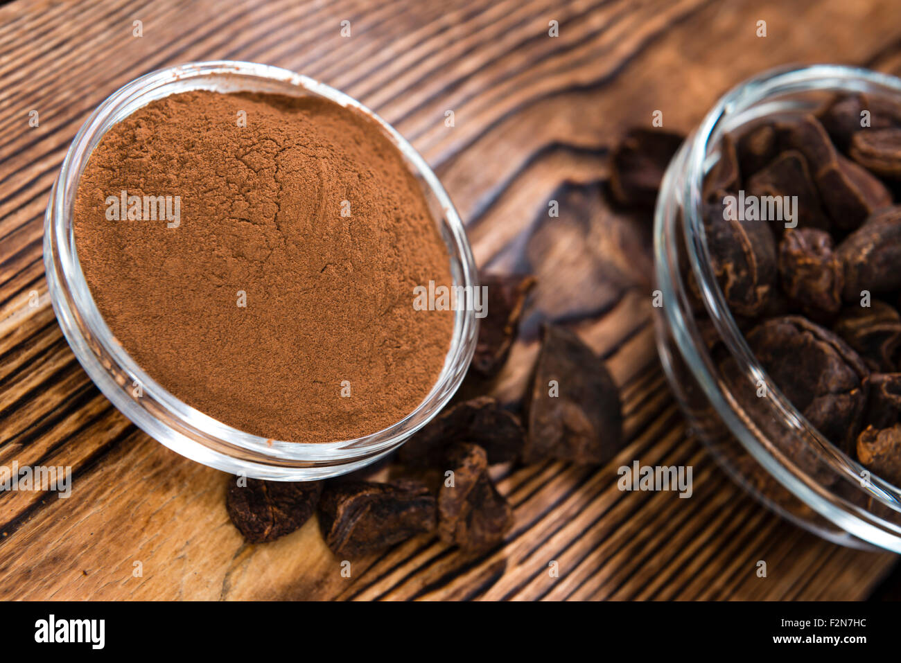 Some Cola Nut Powder (close-up shot) on wooden background Stock Photo ...