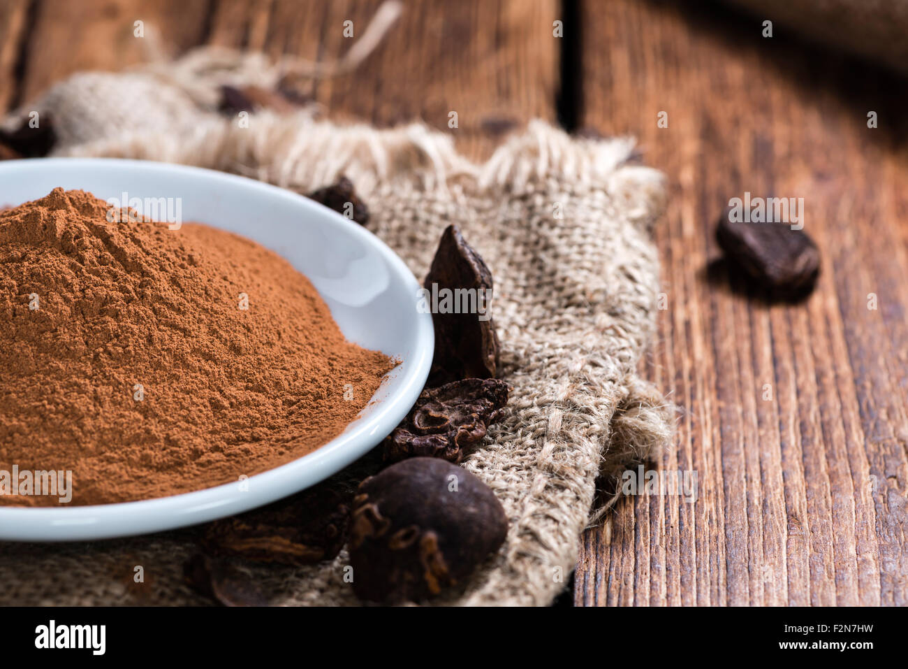 Cola Nut Powder(close-up shot) on vintage wooden background Stock Photo ...