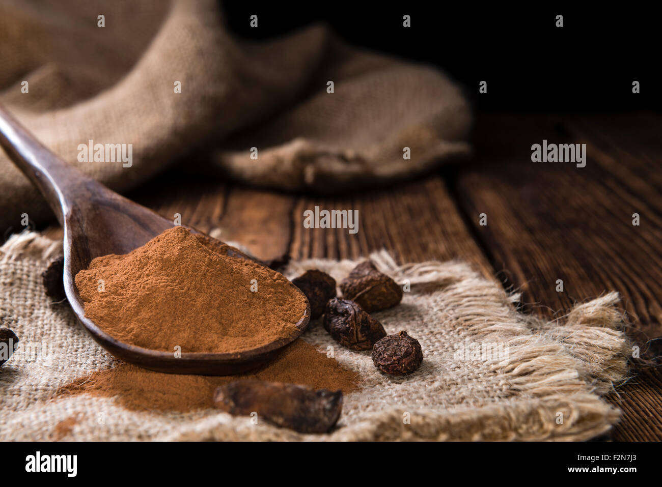 Some Cola Nut Powder (close-up shot) on wooden background Stock Photo ...