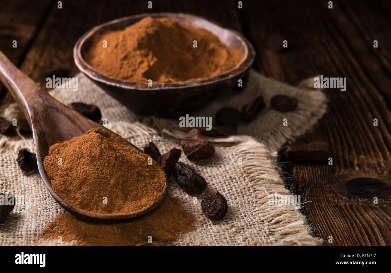 Some Cola Nut Powder (close-up shot) on wooden background Stock Photo ...