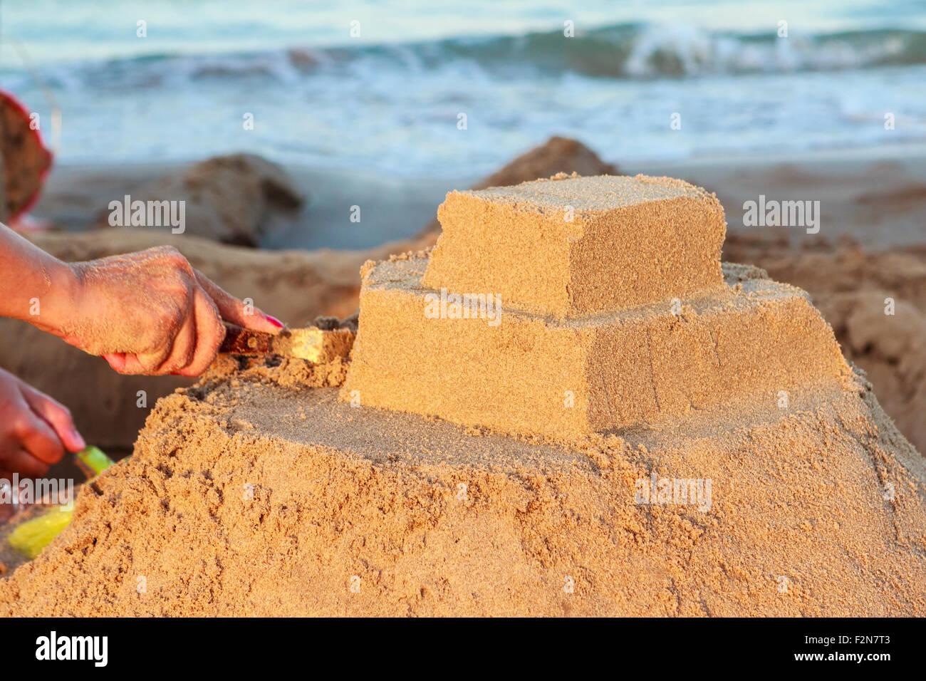 Beach sandcastle sculpting Stock Photo - Alamy