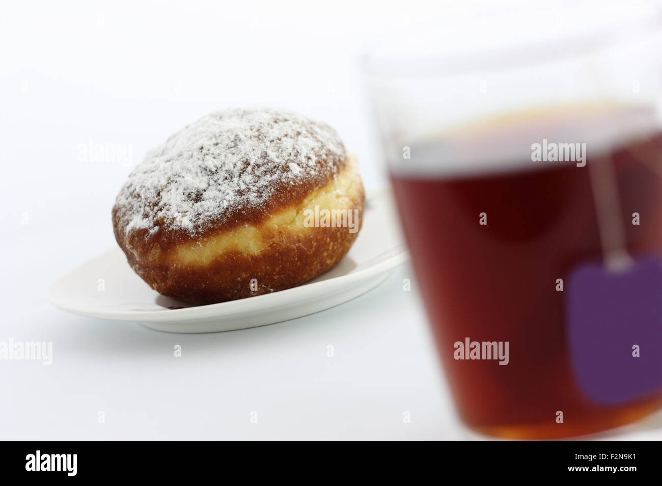 Donut with a cup of tea Stock Photo - Alamy