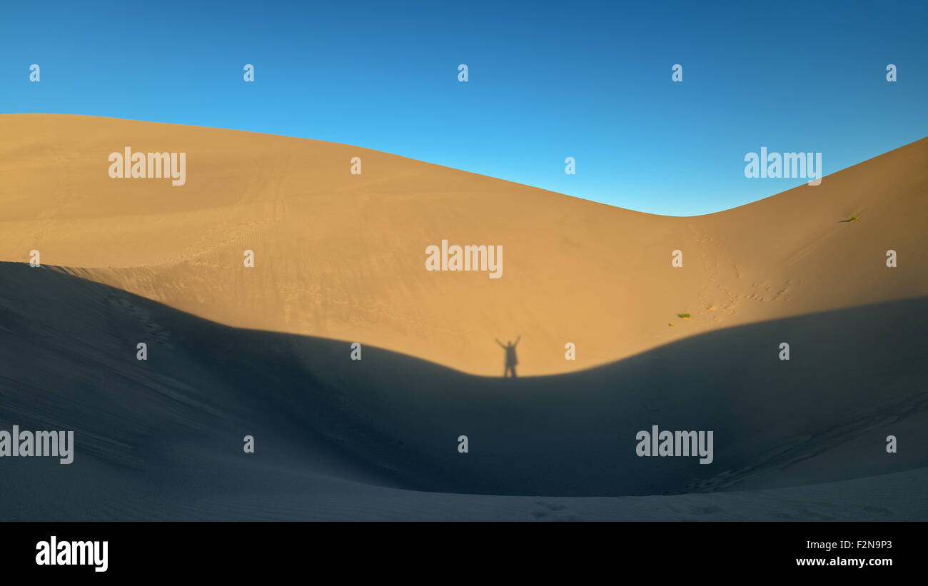 celebratory shadow on a sand dune Stock Photo - Alamy
