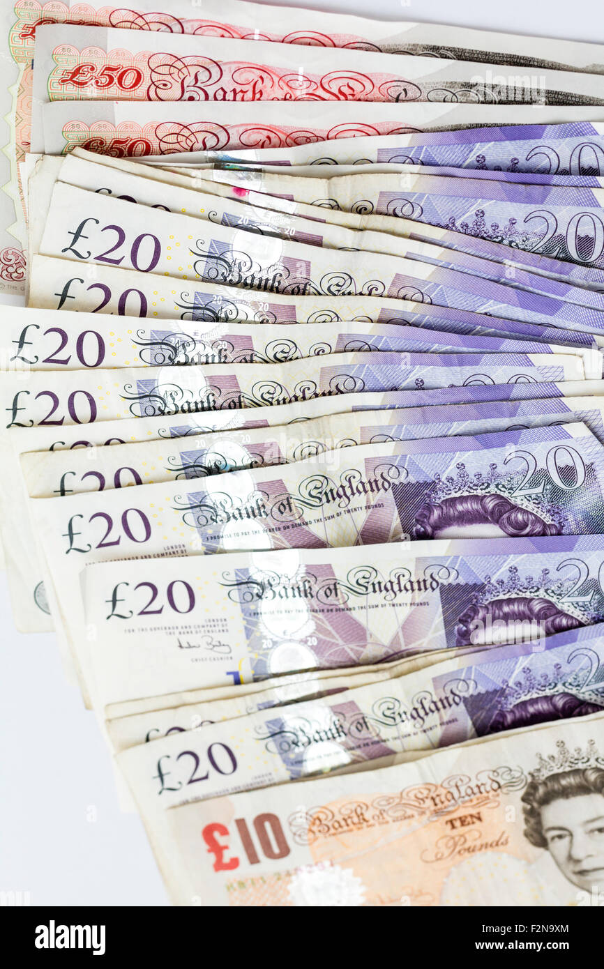 Close up of a half scattered row of British Sterling bank notes, mainly ...