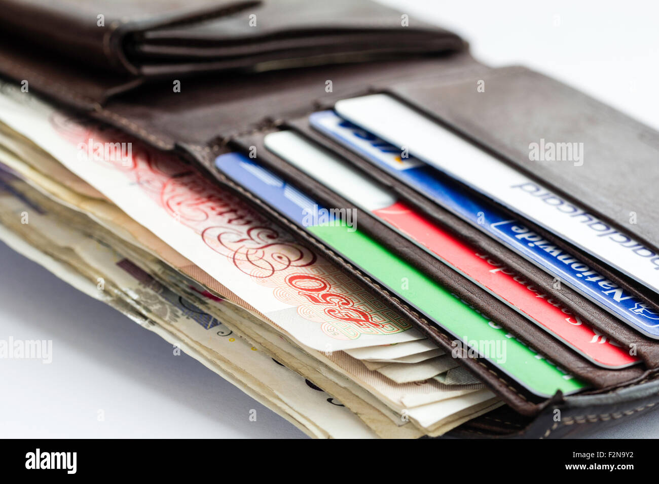 Open wallet showing British sterling pounds in, various banknotes ...