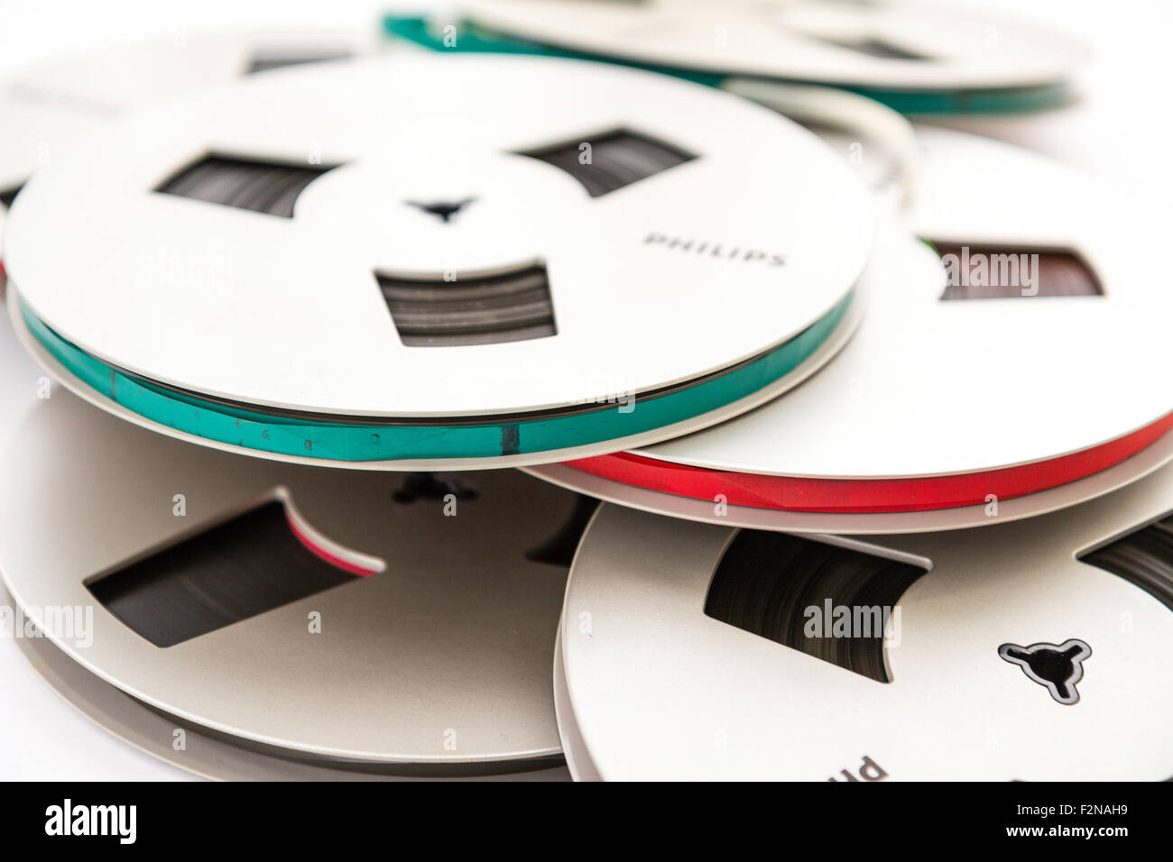 Several Philips reel to reel magnetic tape reels in a scattered pile ...