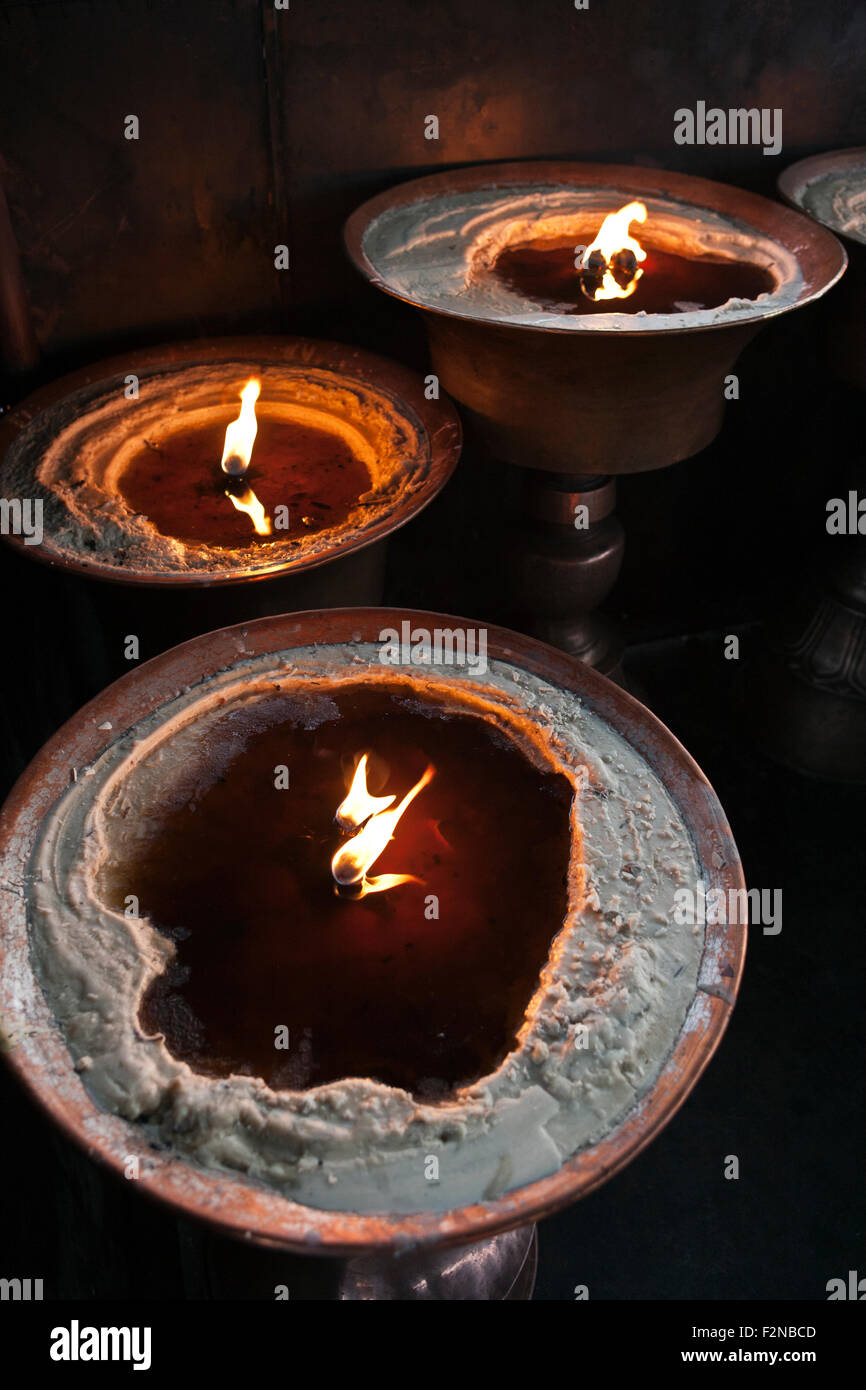 Burning oil lamps Buddhist tradition Stock Photo - Alamy