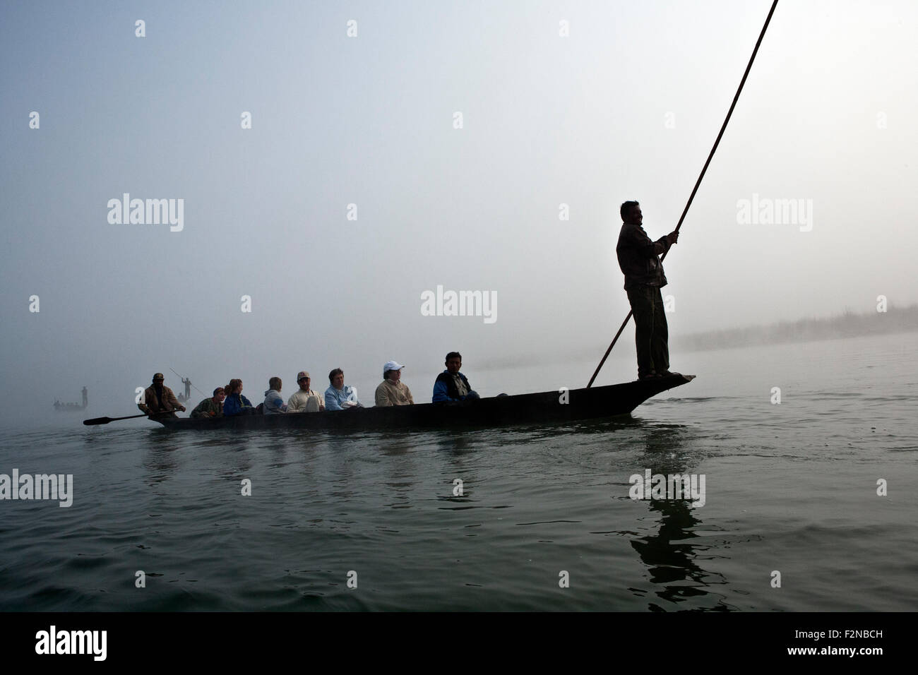 Tourist groups on morning canoe trip on Rapti river in Royal Chitwan ...