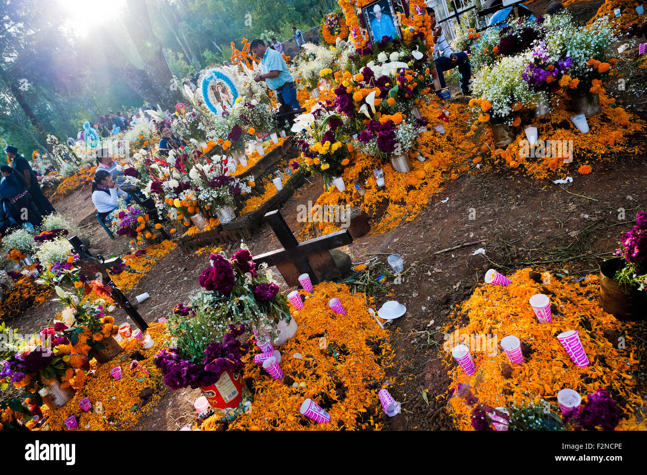 Mexican families gather at the cemetery to honor the deceased during ...