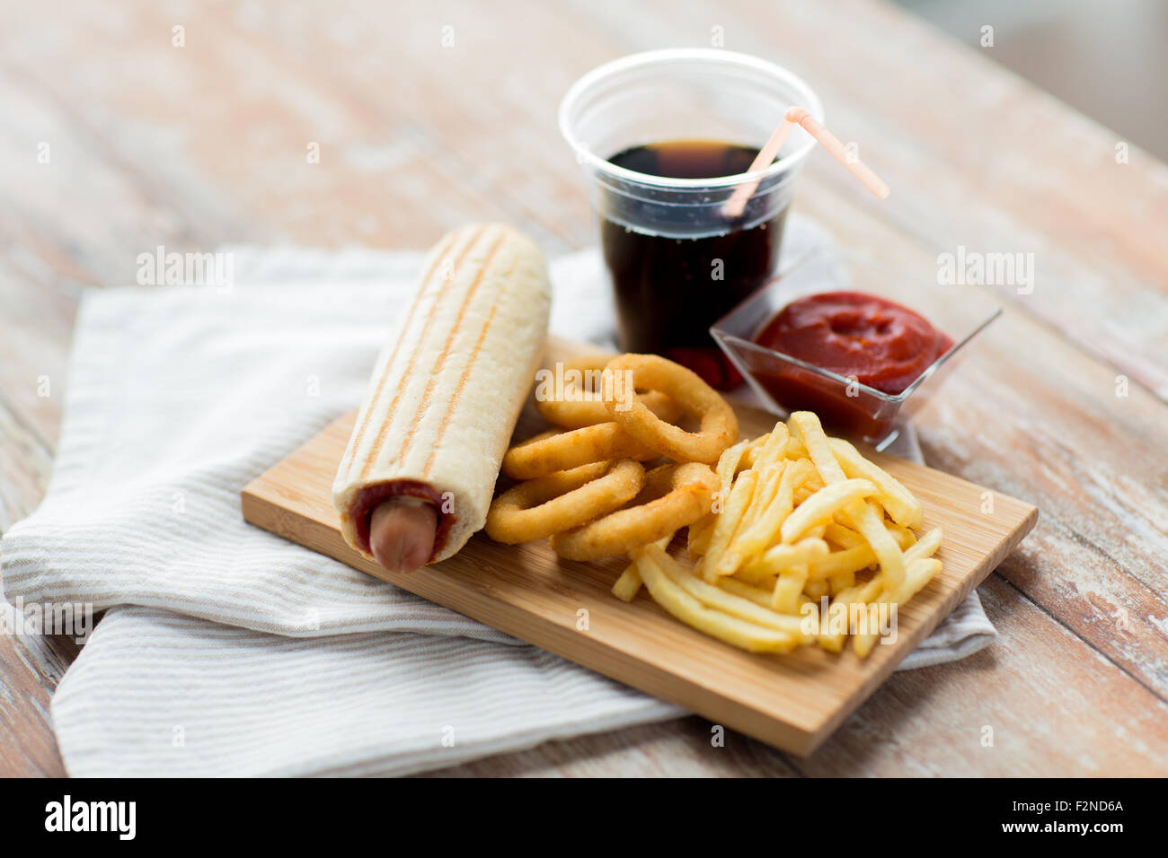 close up of fast food snacks and drink on table Stock Photo - Alamy