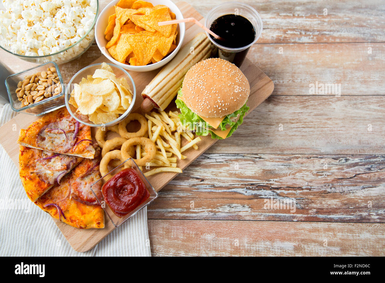 close up of fast food snacks and drink on table Stock Photo - Alamy