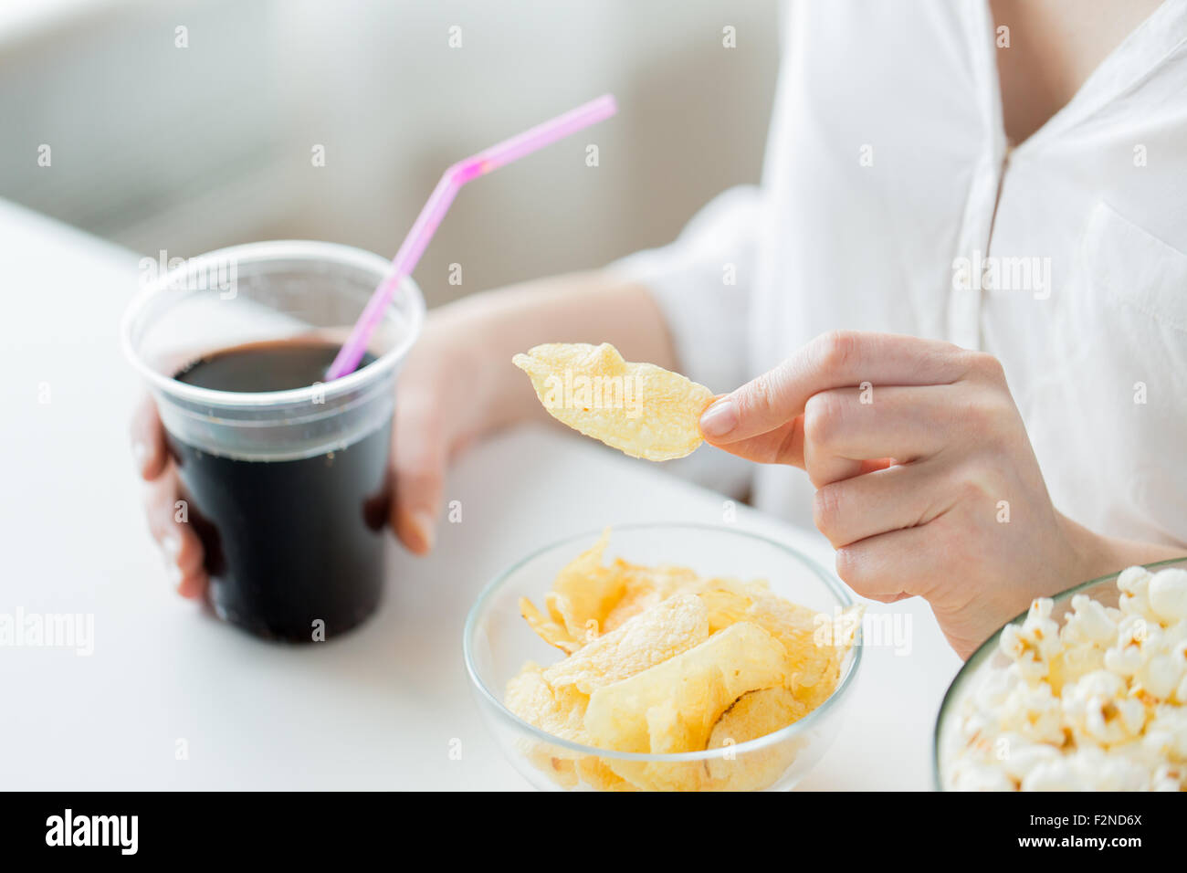close up of woman with junk food and coca cola cup Stock Photo - Alamy