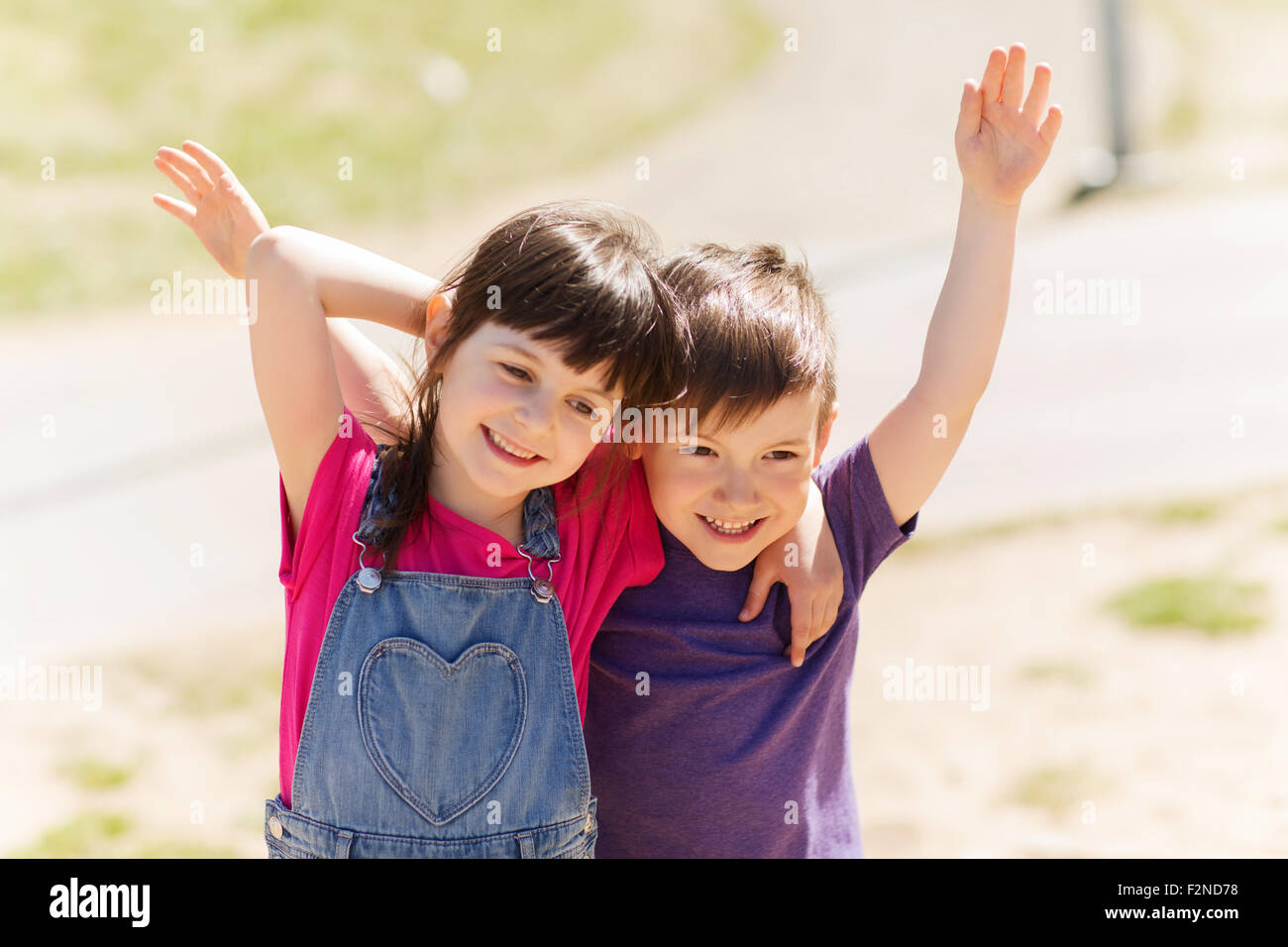 two happy kids hugging outdoors Stock Photo - Alamy
