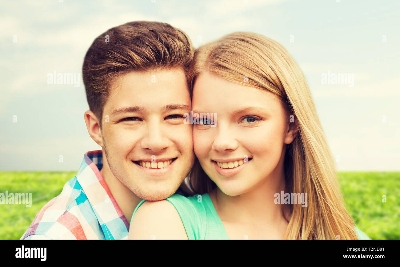 smiling couple hugging over natural background Stock Photo - Alamy