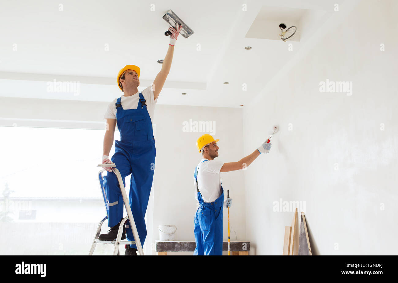 group of builders with tools indoors Stock Photo - Alamy