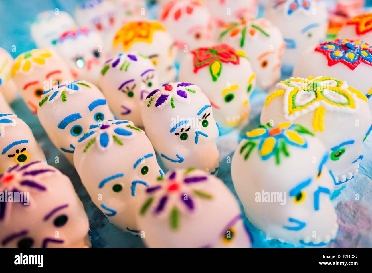 Colorful sugar skull candies are sold on the market during the Day of ...