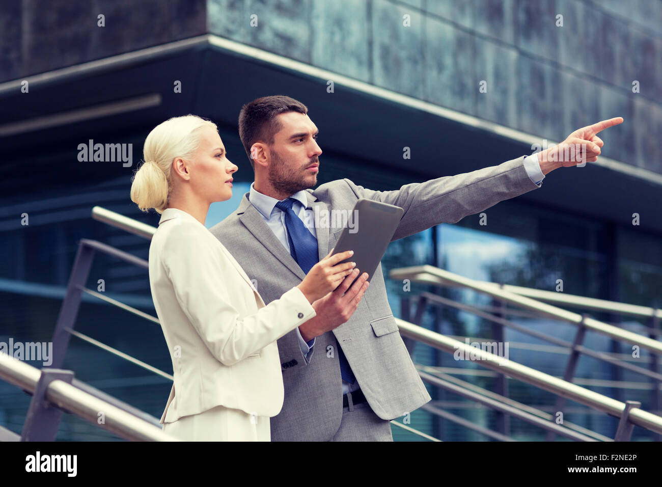 serious businessmen with tablet pc outdoors Stock Photo - Alamy