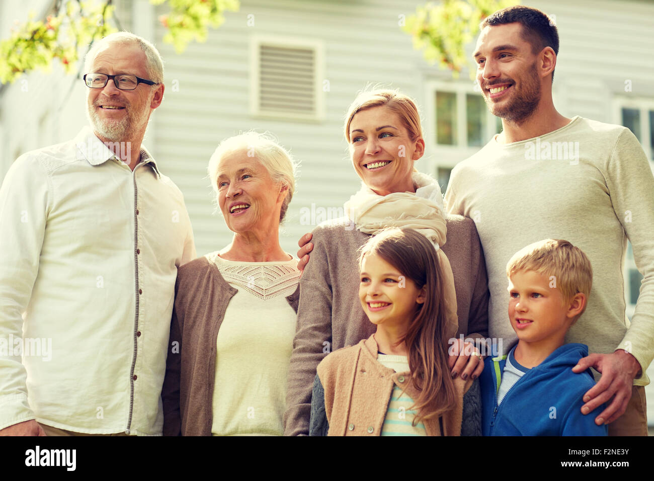 happy family in front of house outdoors Stock Photo - Alamy