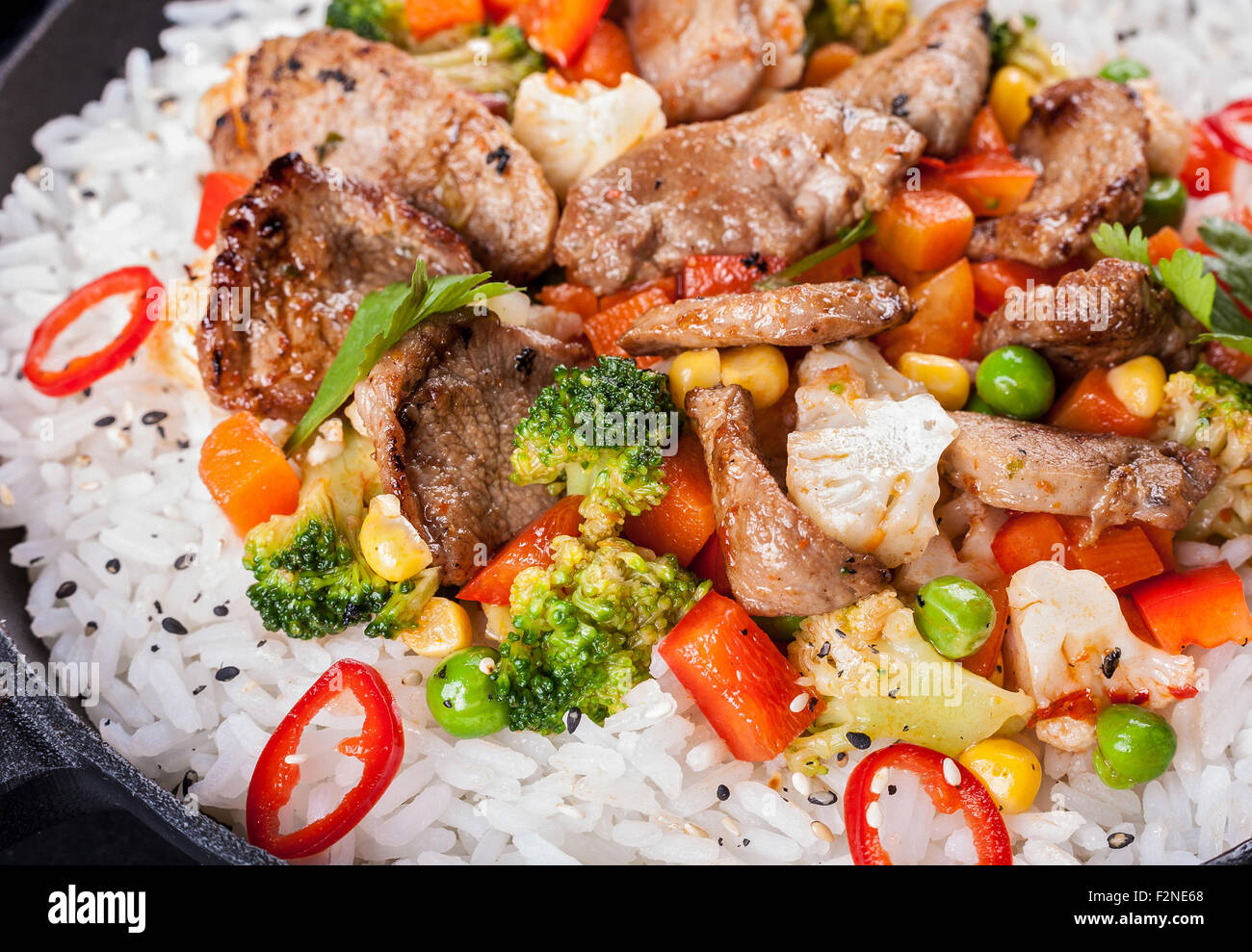 White rice veal meat and vegetable Stock Photo - Alamy